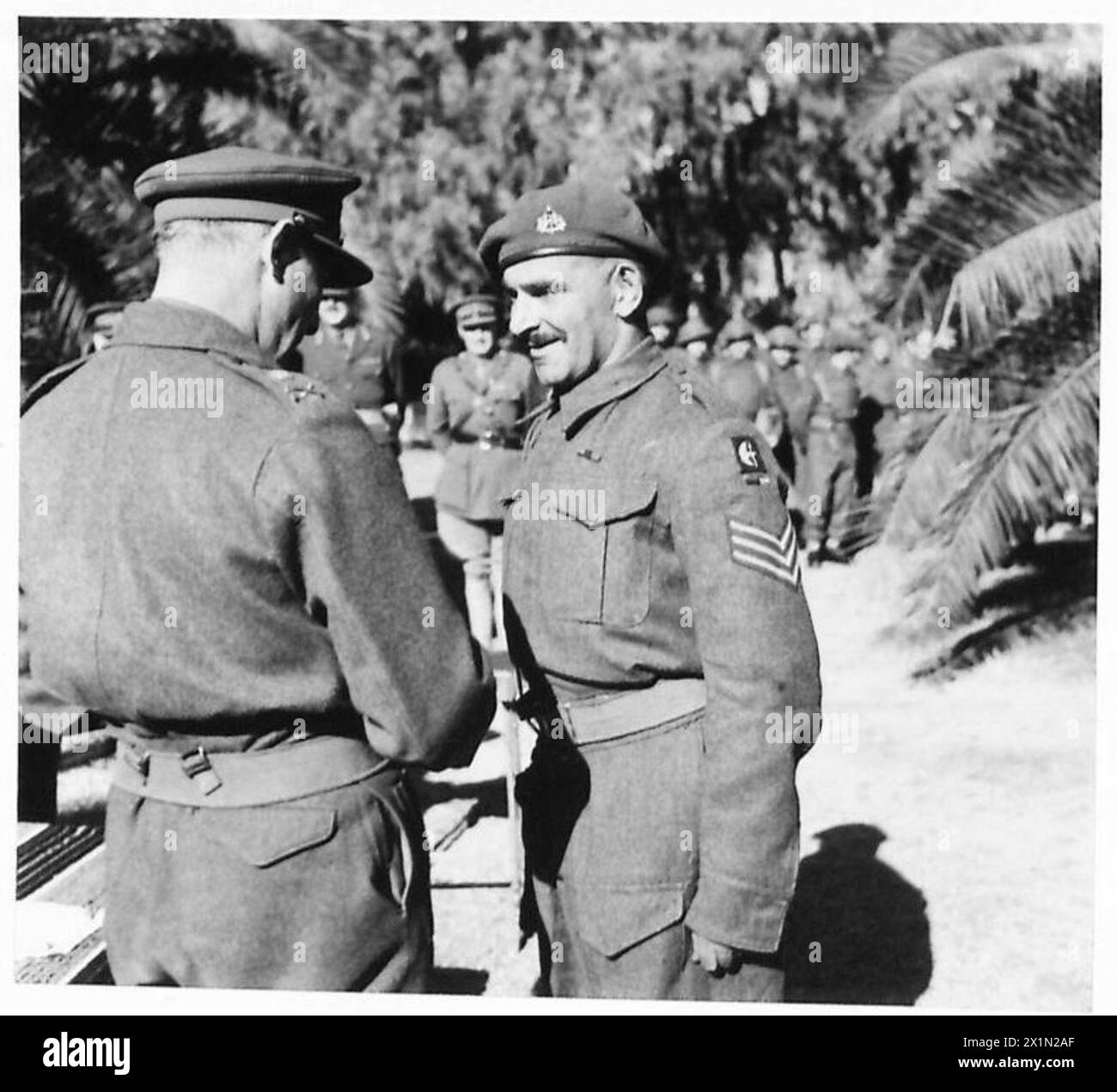 General Kenneth Anderson decorates Sergeant B. Finn of the 56th ...