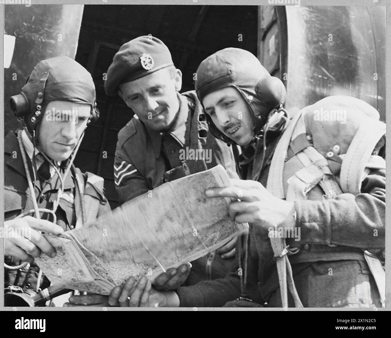 Flight Sergeant N. Pfeiffer and Sergeant Harris study a course with ...