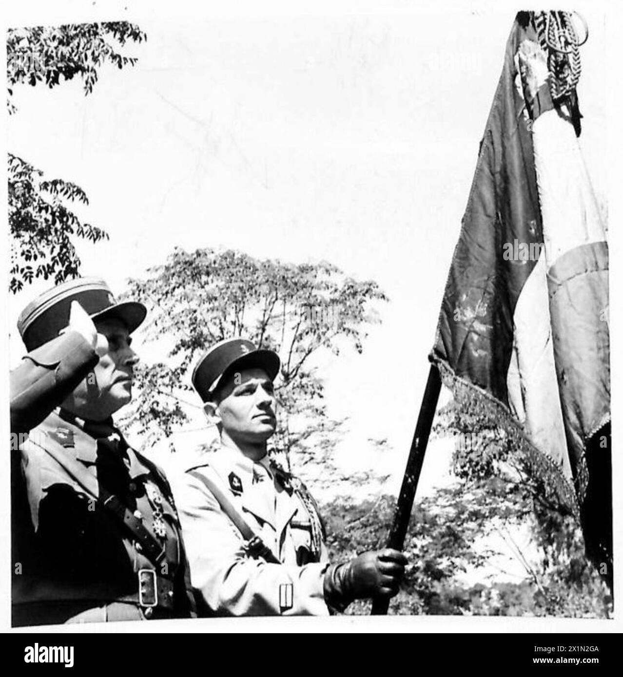 Colonel Boucher salutes the returned French regimental colours during a ...