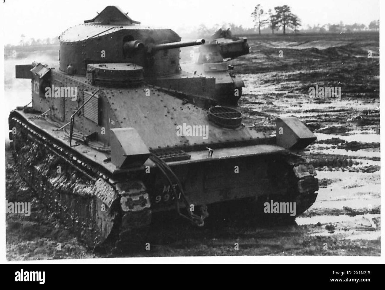 THE ROYAL TANK CORPS AT ALDERSHOT - A tank on manoeuvres travelling at ...