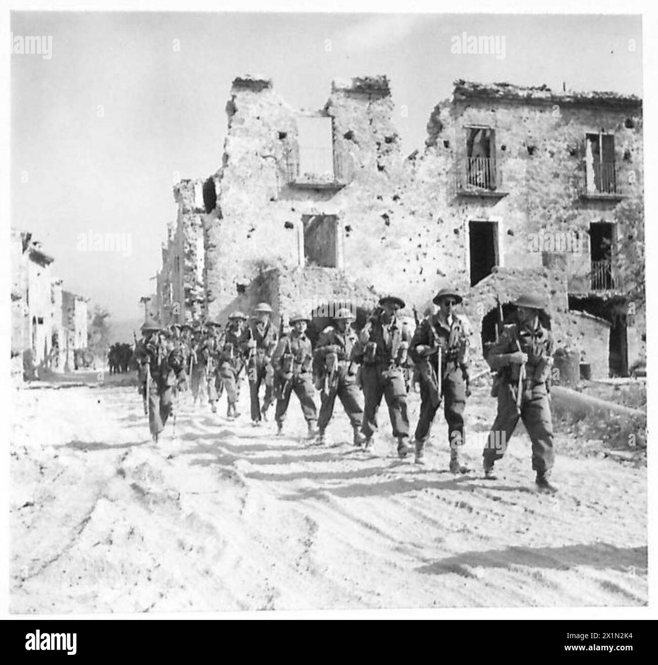 Infantrymen of the 1st Canadian Division advance through Panaccino in ...
