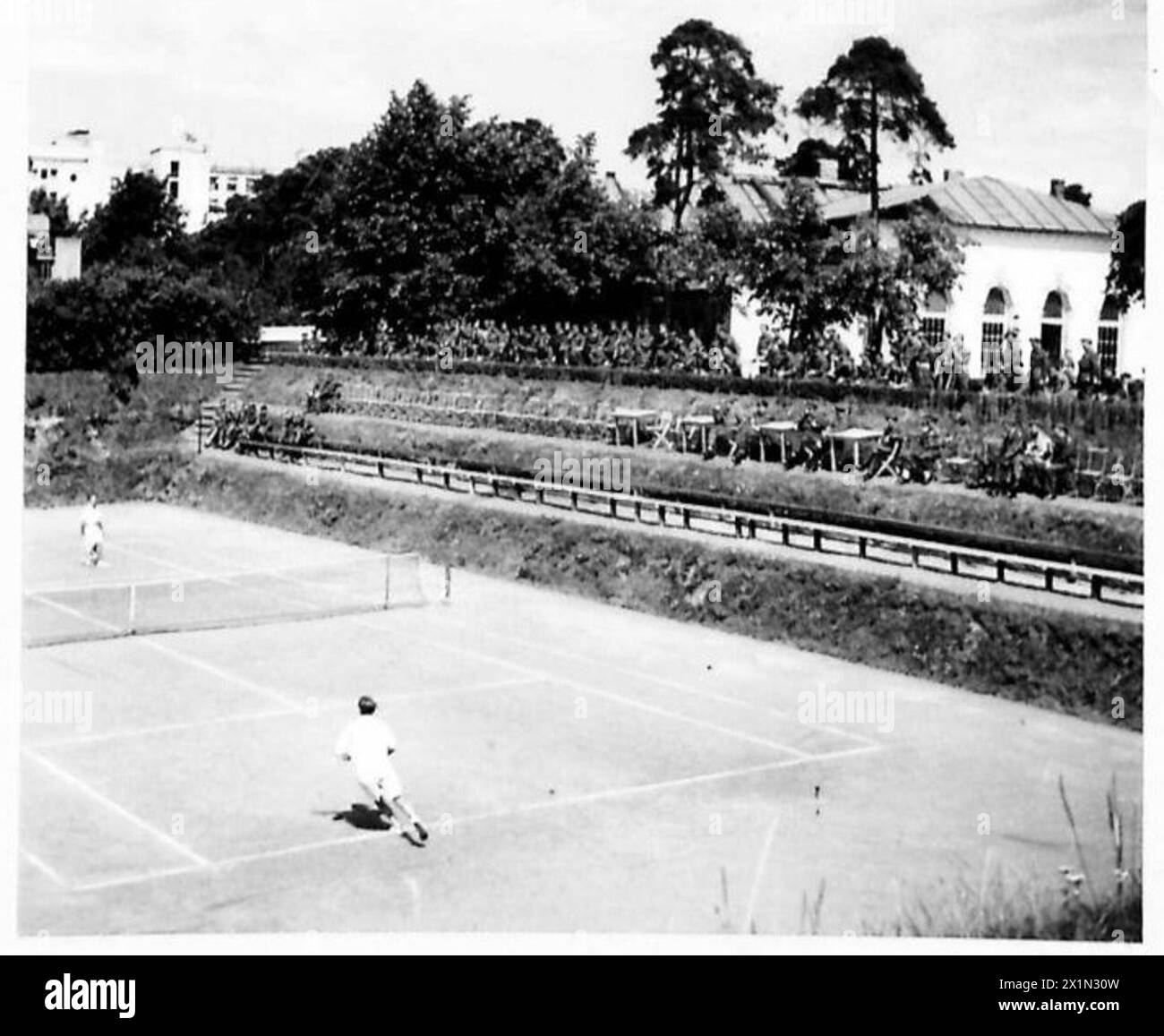 A tennis exhibition at the Jerboa Club in Berlin is attended by Major ...