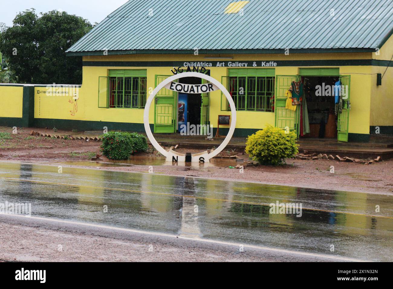 Uganda Equator. Equator line in Africa. After rain at equator. Masaka ...