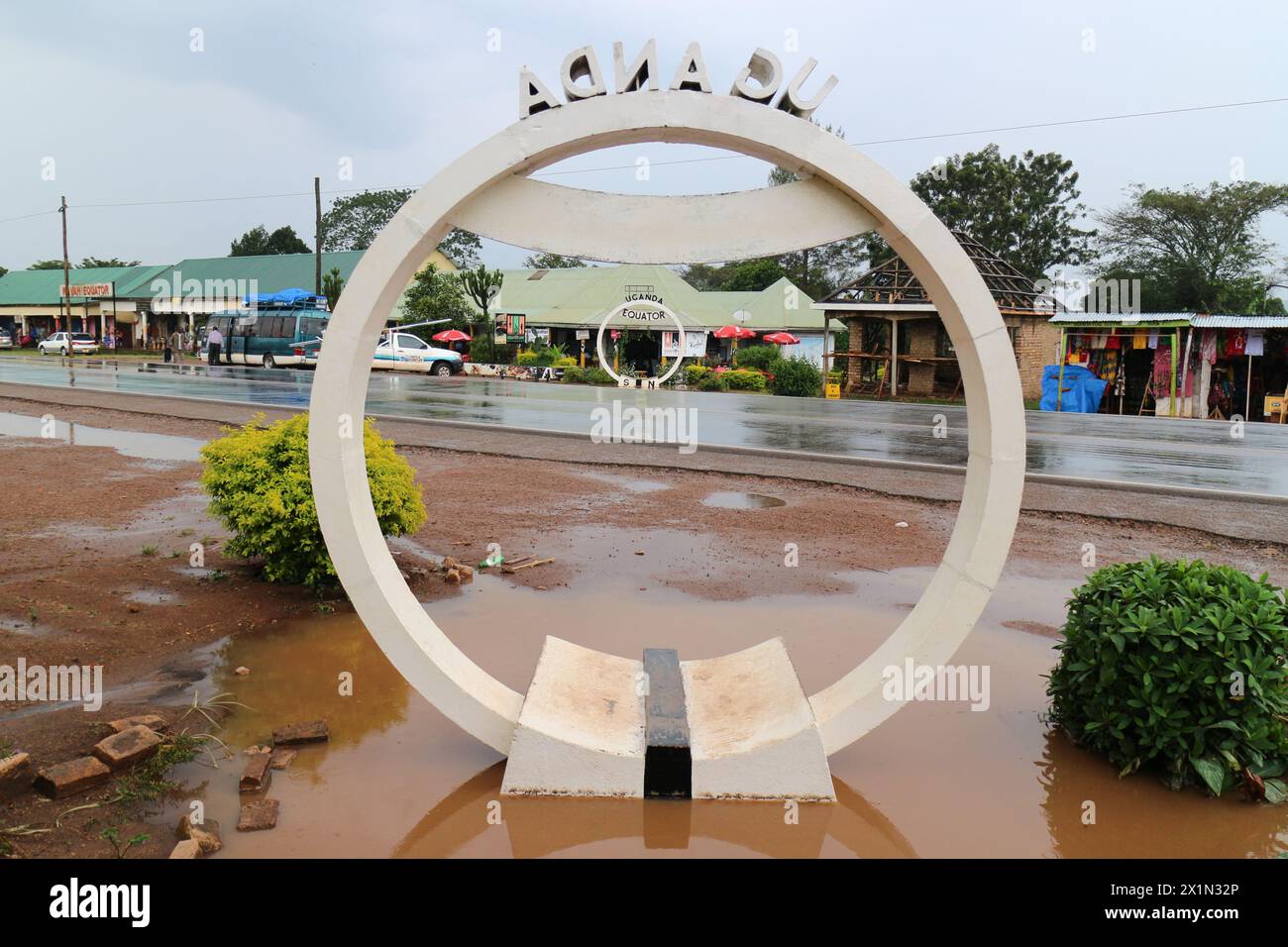 Uganda Equator. Equator line in Africa. After rain at equator. Masaka ...
