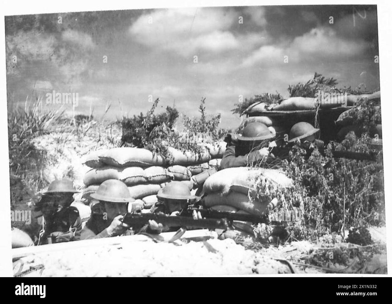 Soldiers of the Green Howards regiment are positioned in a sandbagged ...