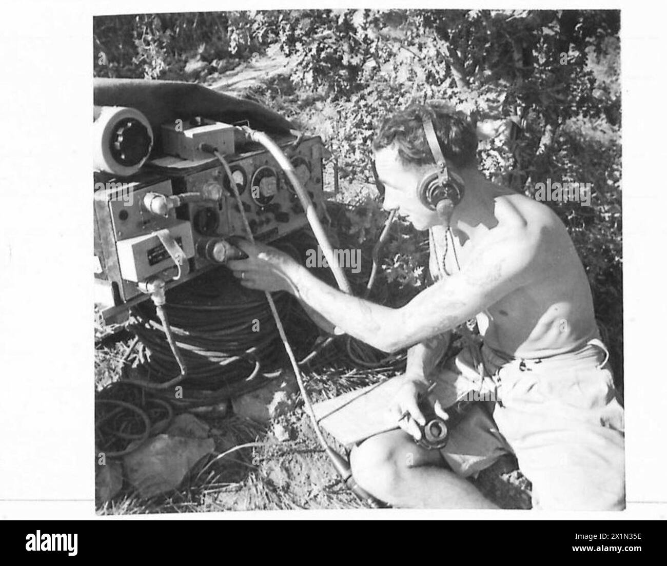 Signaller A.G. Norris of the Eighth Army receives targeting information ...