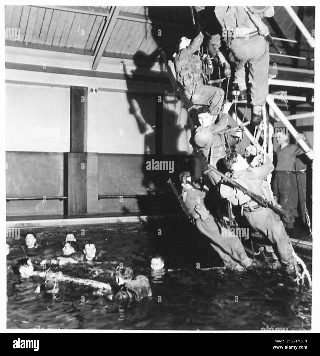 Army Physical Training Corps personnel conduct a swimming demonstration ...
