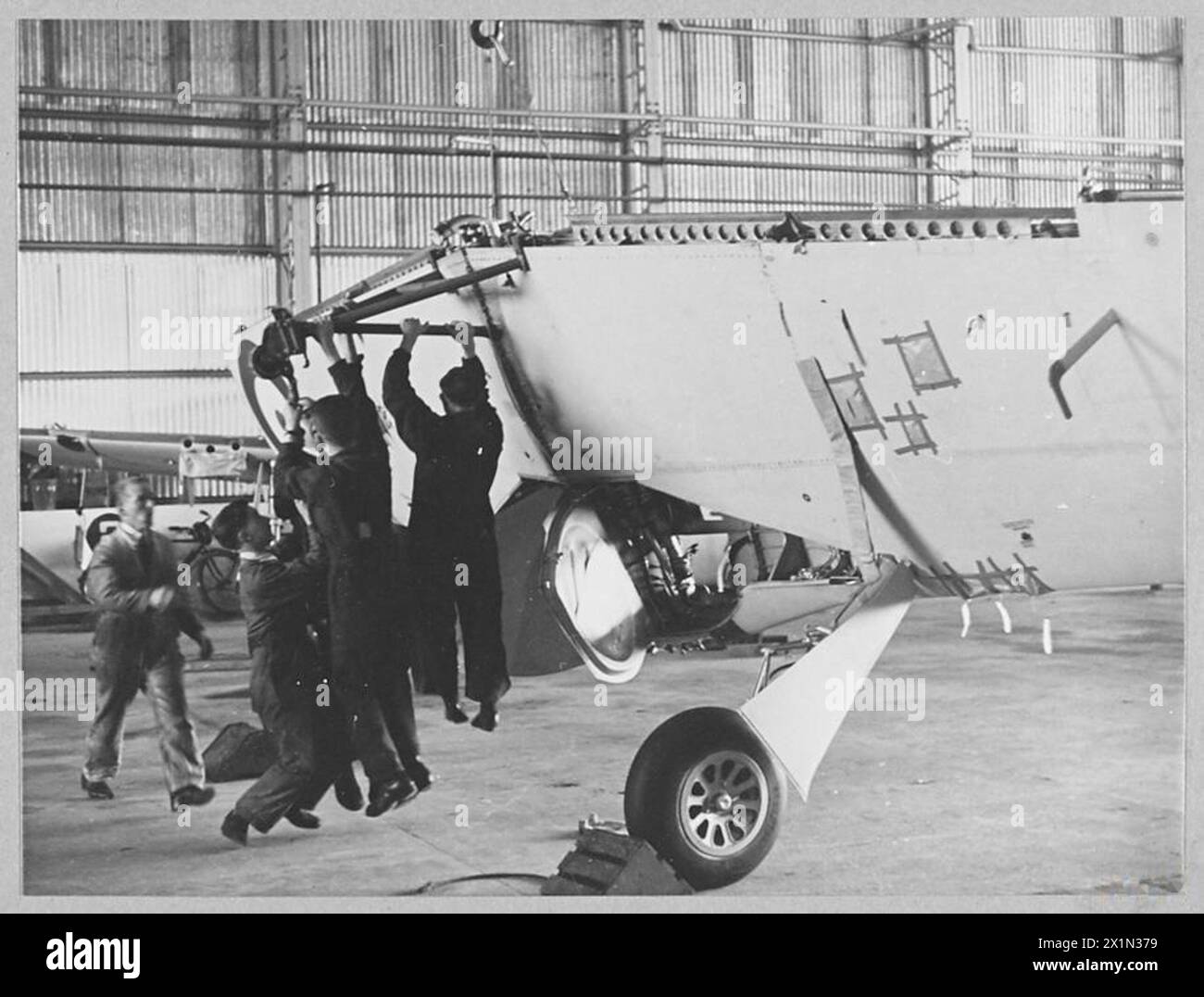 The main wing assembly of a U.S. Mustang aircraft is positioned on its ...