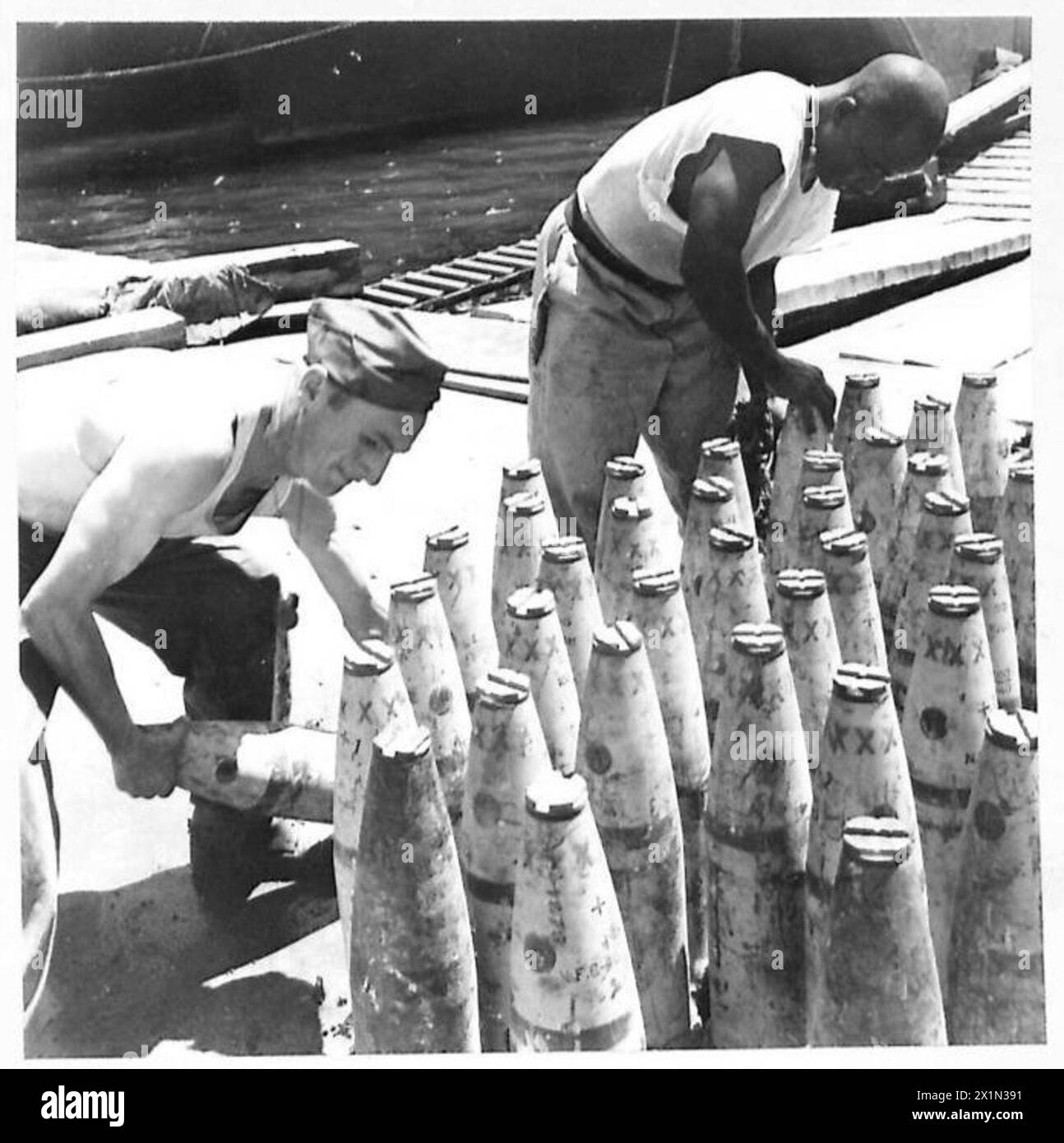 THE CAPTURED BASE OF AUGUSTA - Black and white Pioneers work side by ...
