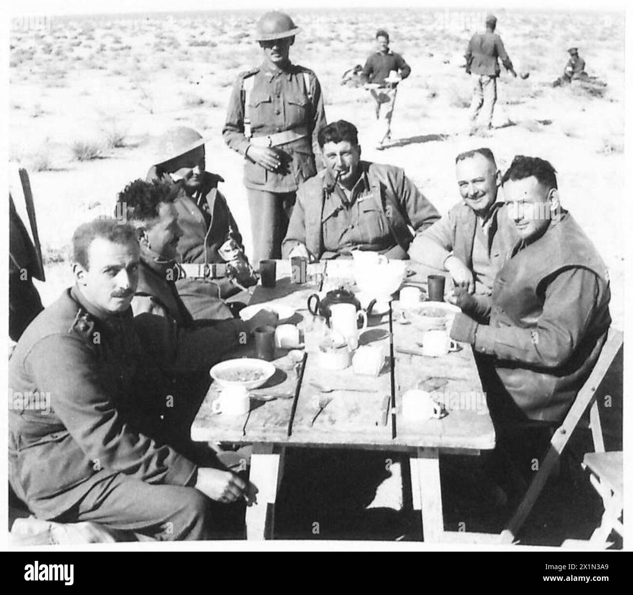 THE FALL OF TOBRUK - An open air officers' mess. Officers having a meal ...