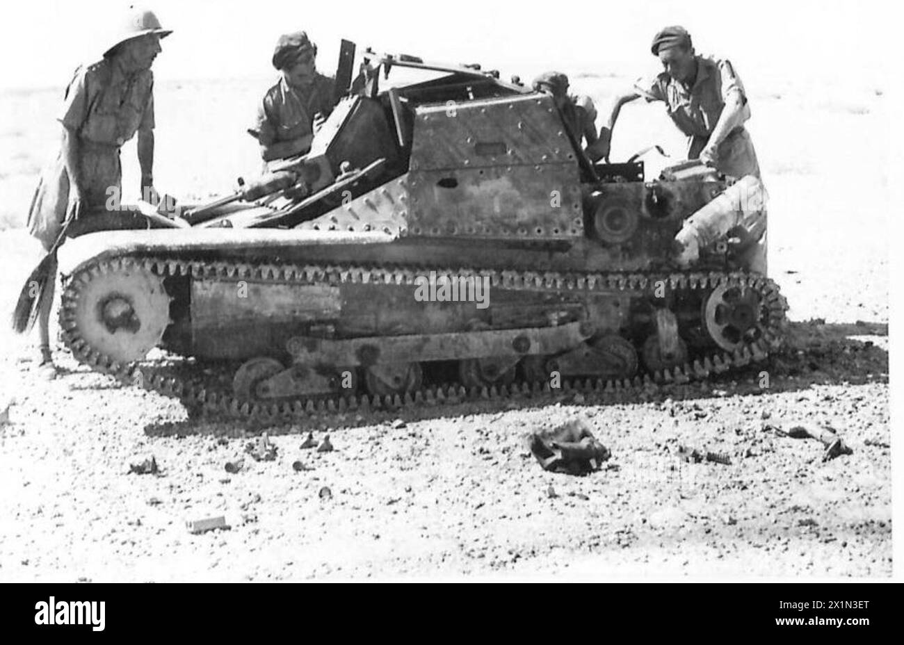 ACTIVITY IN THE WESTERN DESERT - Examining a battered Italian light ...
