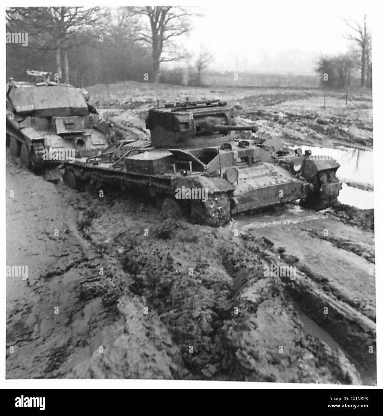 TESTING TANKS IN MUD - A Valentine tank towing a Cruiser Mk. IV through ...
