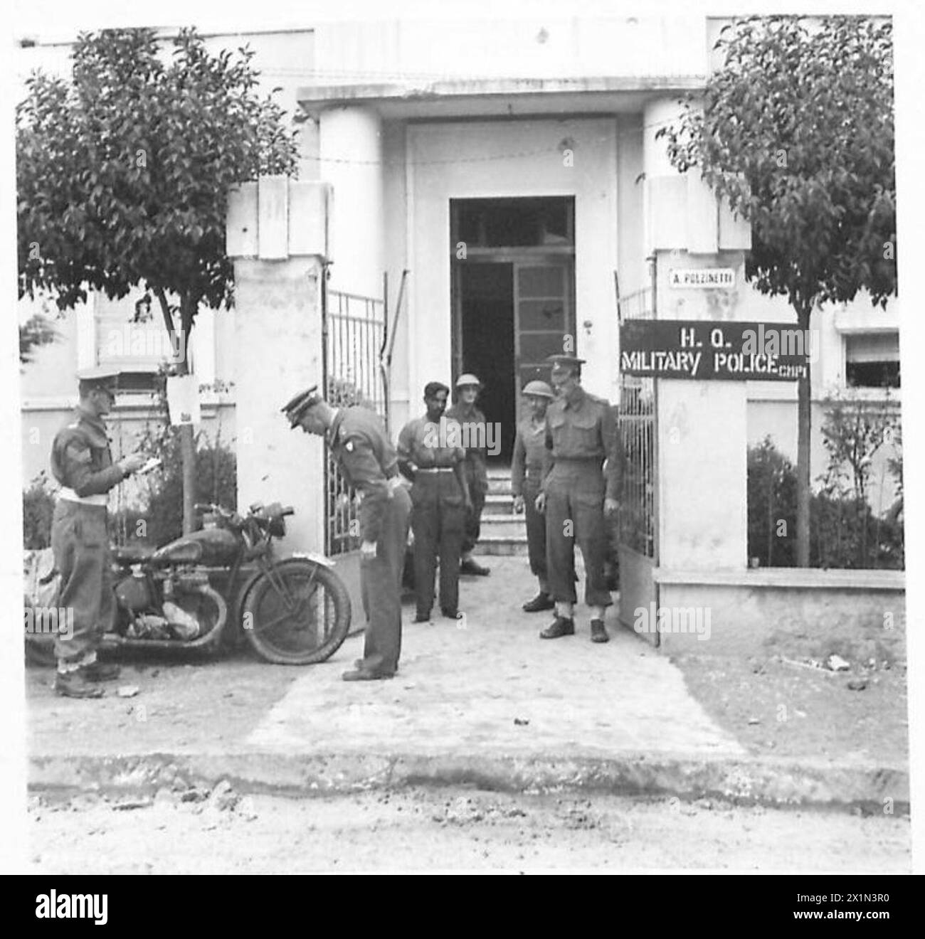 Lieut. F.G. Sisseen inspects a motorcycle recently damaged by heavy ...