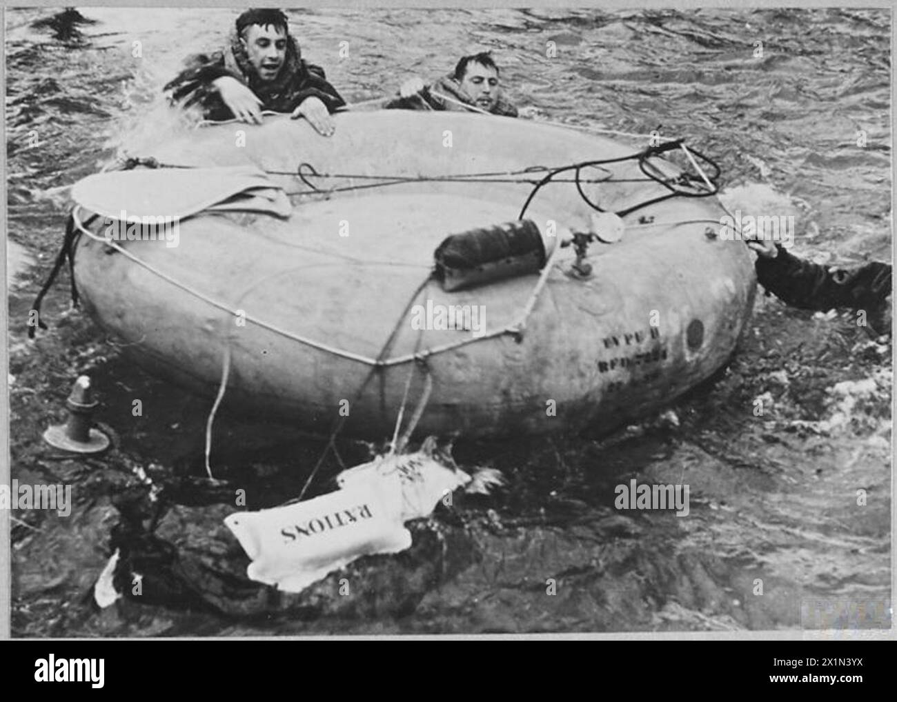 RUBBER DINGHY OF THE R.A.F. - [1260] The crew swim alongside. Note the rum and iron ration ...