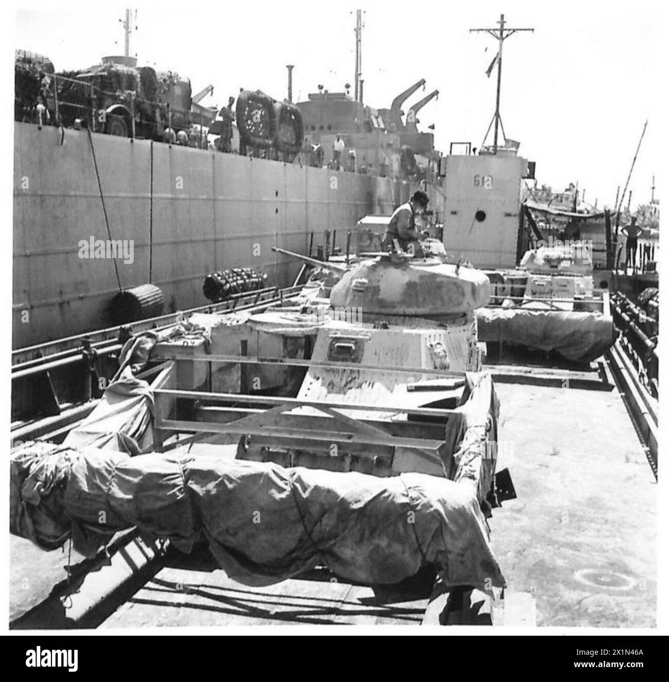 British Army personnel load a 'Scorpion' tank and additional armoured ...