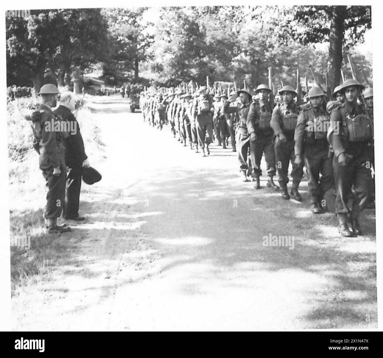 ROUNDING UP ENEMY PARACHUTISTS - A motor cyclist platoon moving across ...