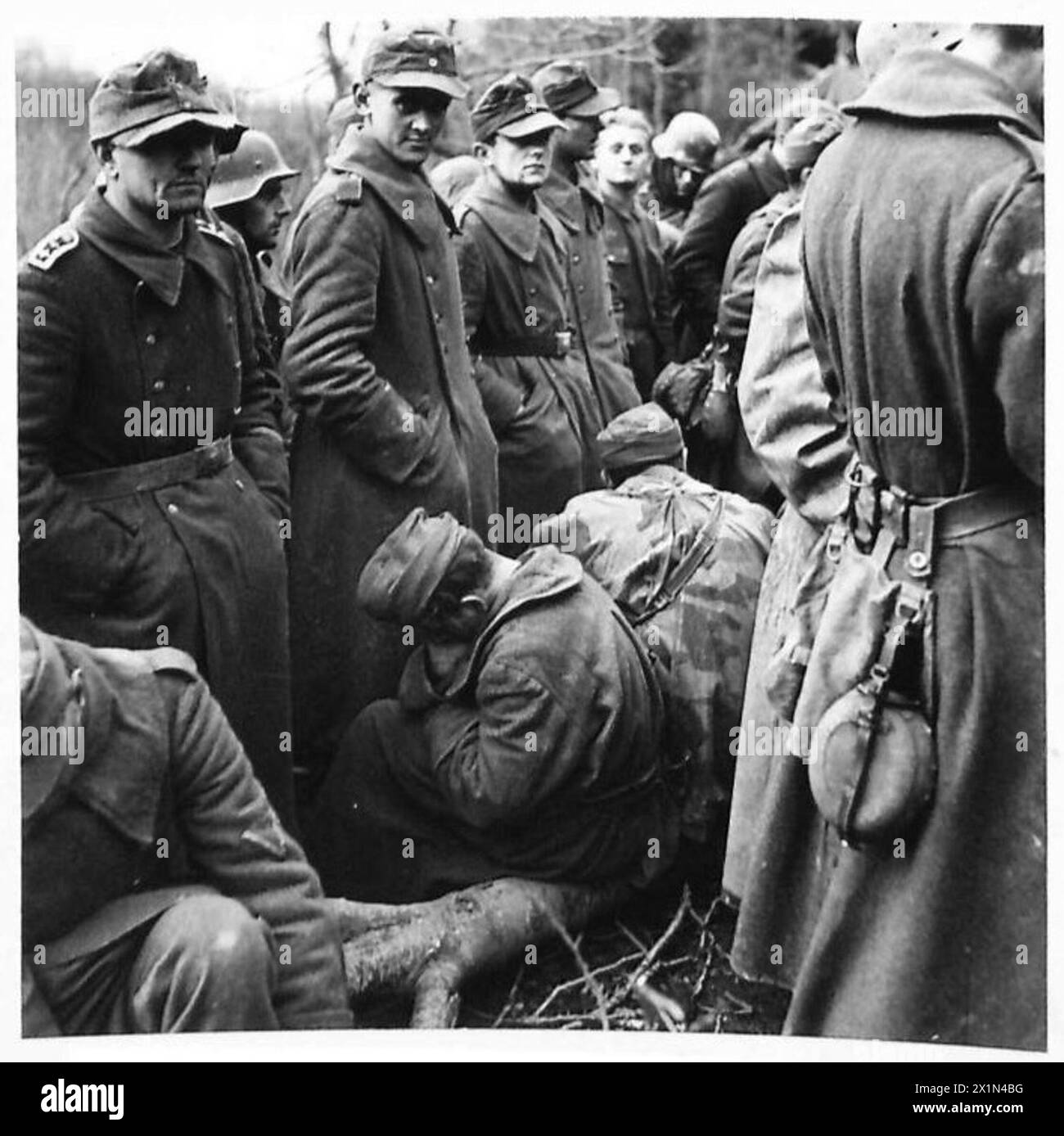 A group of prisoners from Fifth Army in Italy are held in British lines ...