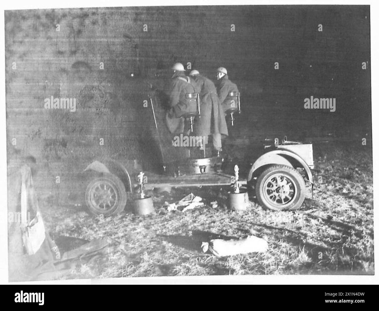 Anti-aircraft guns are shown firing at night, demonstrating the ...