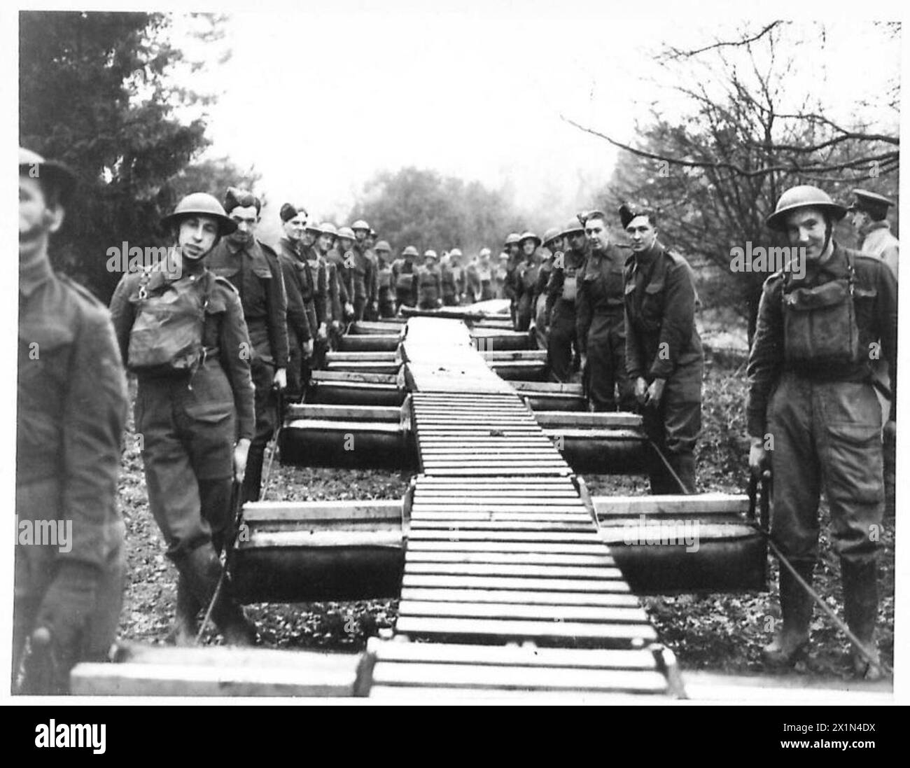 BUILDING A KAPOK BRIDGE - The bridge assembled and troops mass-lifting ...