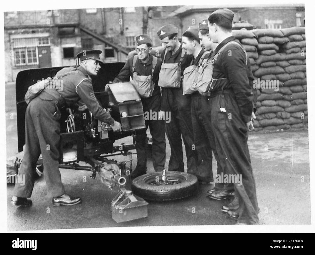British Army anti-tank gunners receive instruction in light gun laying ...
