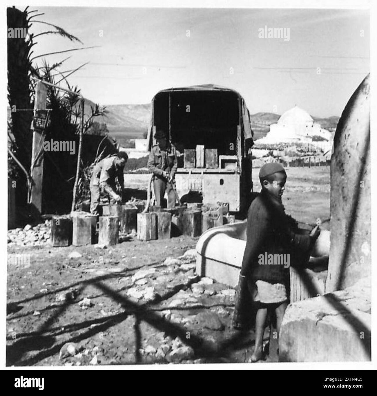 WATER SUPPLY FOR THE FIRST ARMY - Water can being filled for issue to ...