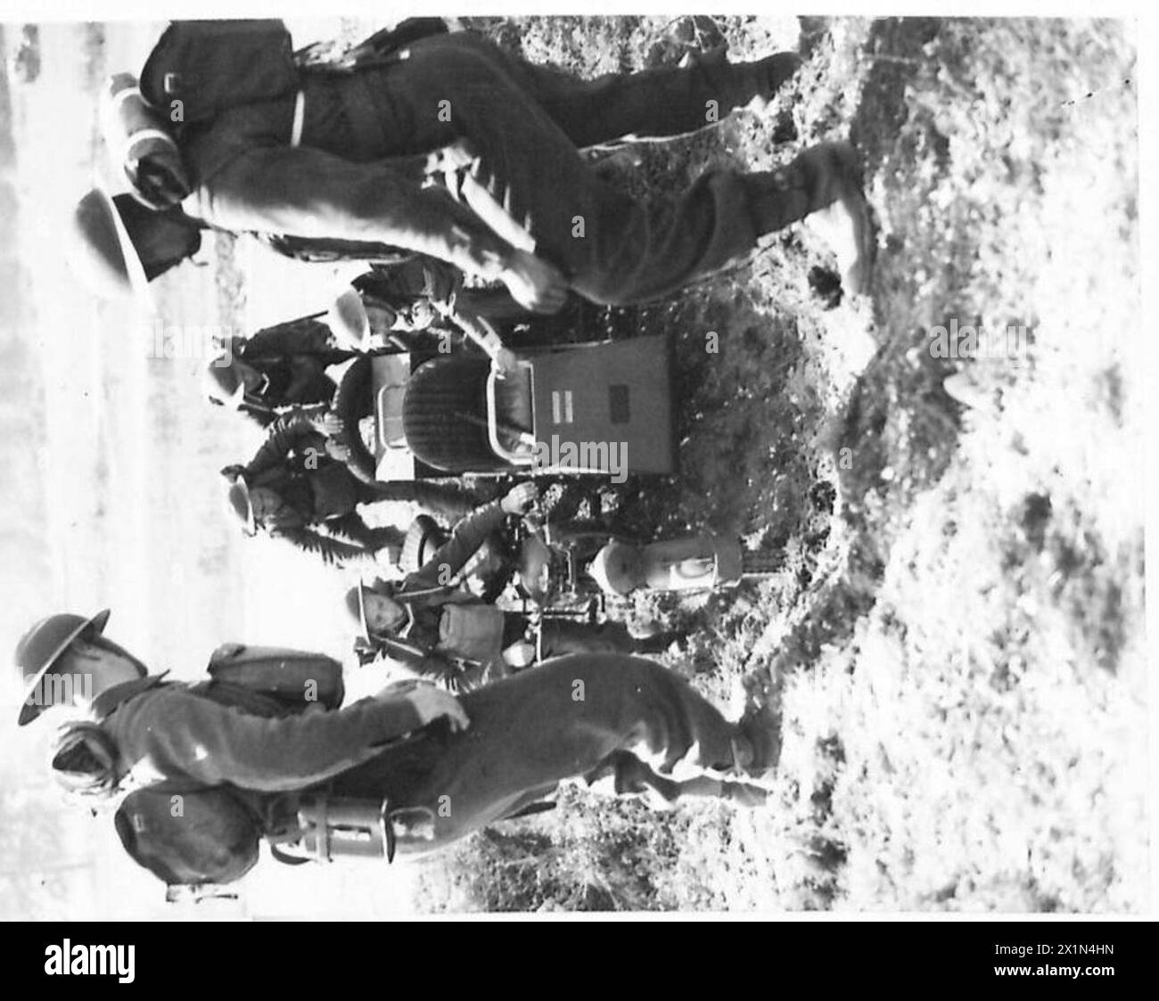 British Army motorcycle reconnaissance troops push a sidecar over a ...