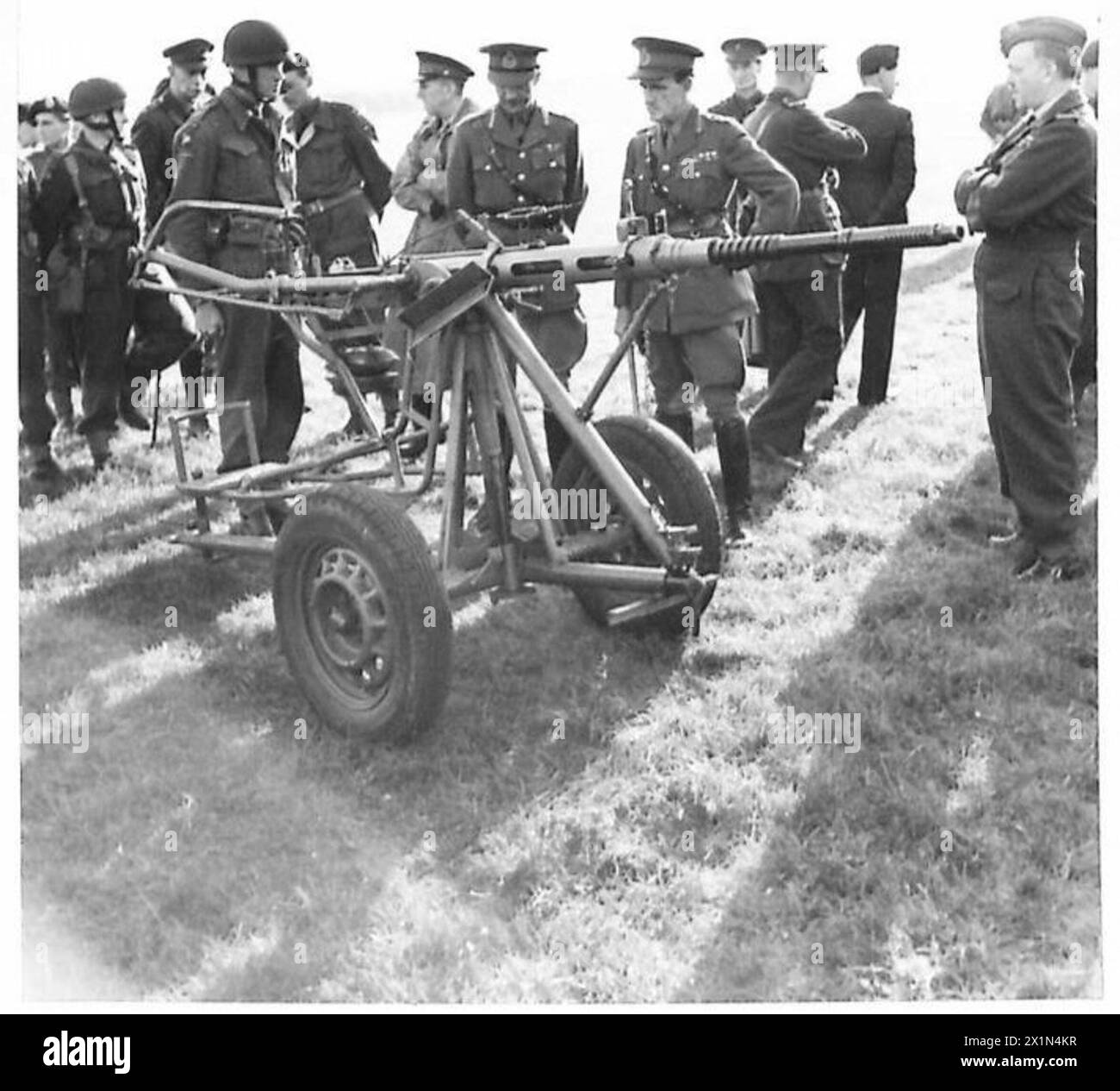 Army and Air Force commanders observe a light gun demonstration by the ...