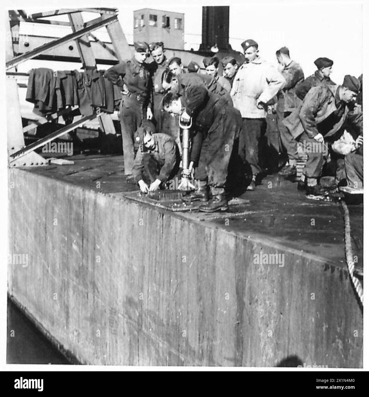 SPECIAL ASSIGNMENT FOR TN.5 - Showing the bolt gun in use, fixing the ...