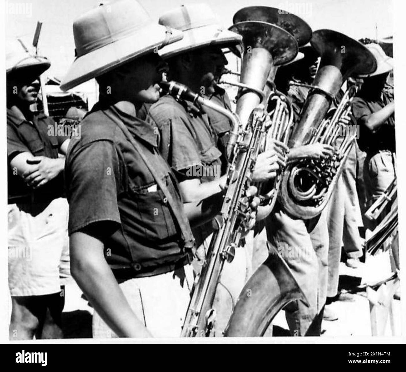 DAILY ROUTINE AT PRISONERS OF WAR CAMP IN WESTERN DESERT - These three ...