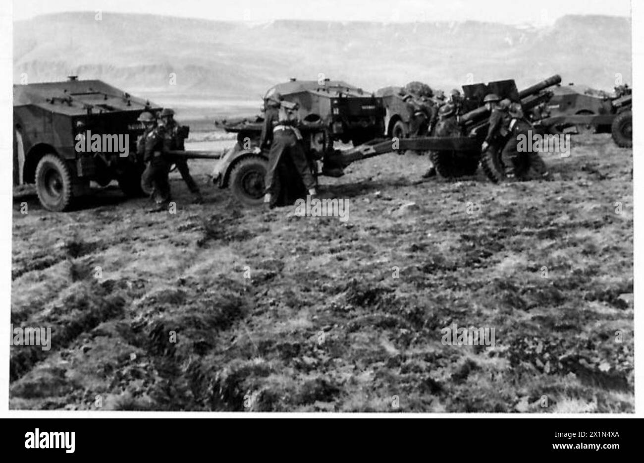 British troops in Iceland tow field guns across rough terrain using ...