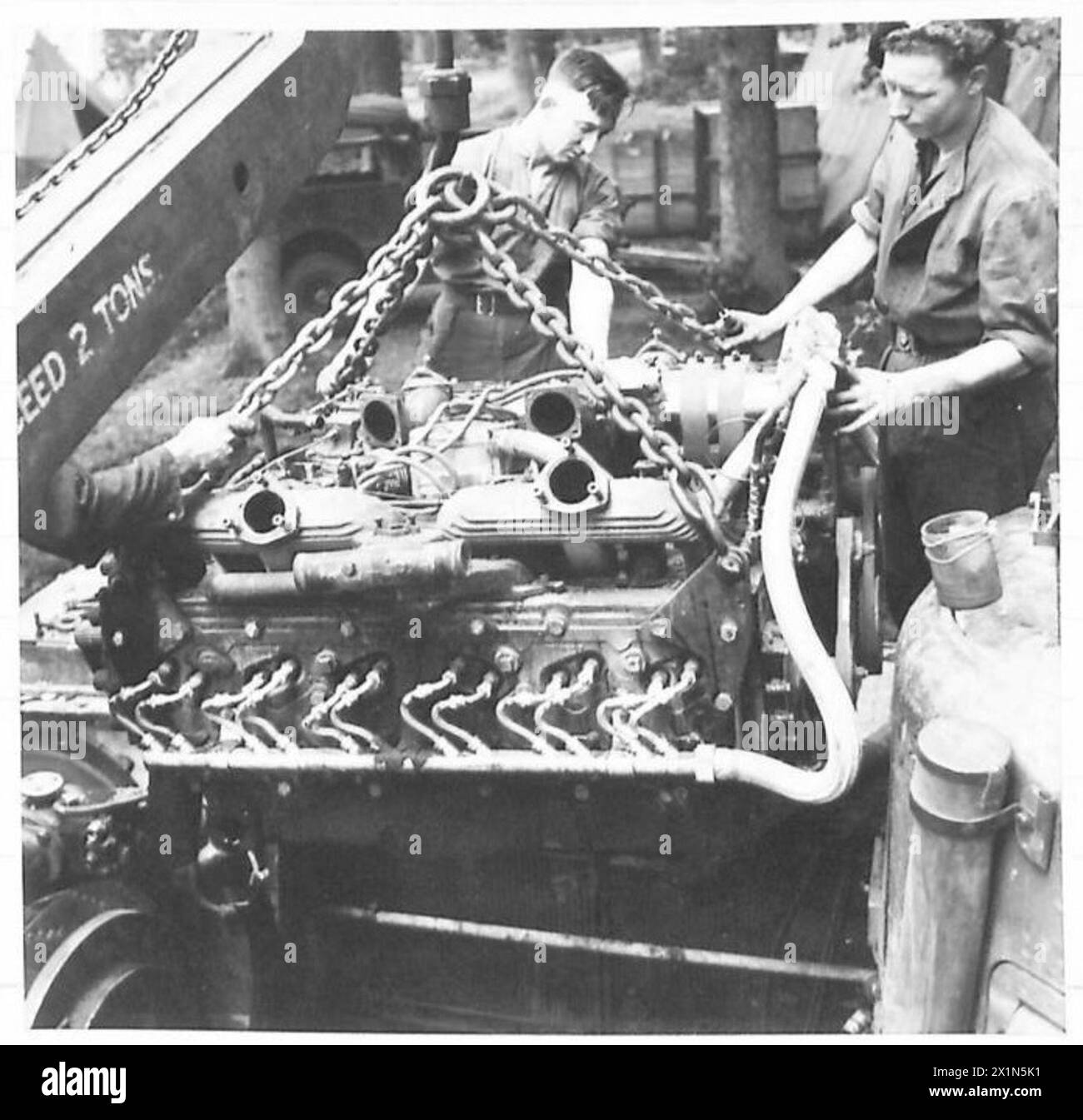 TANK RECOVERY AND REPAIR - With chains securely attached to the tank ...