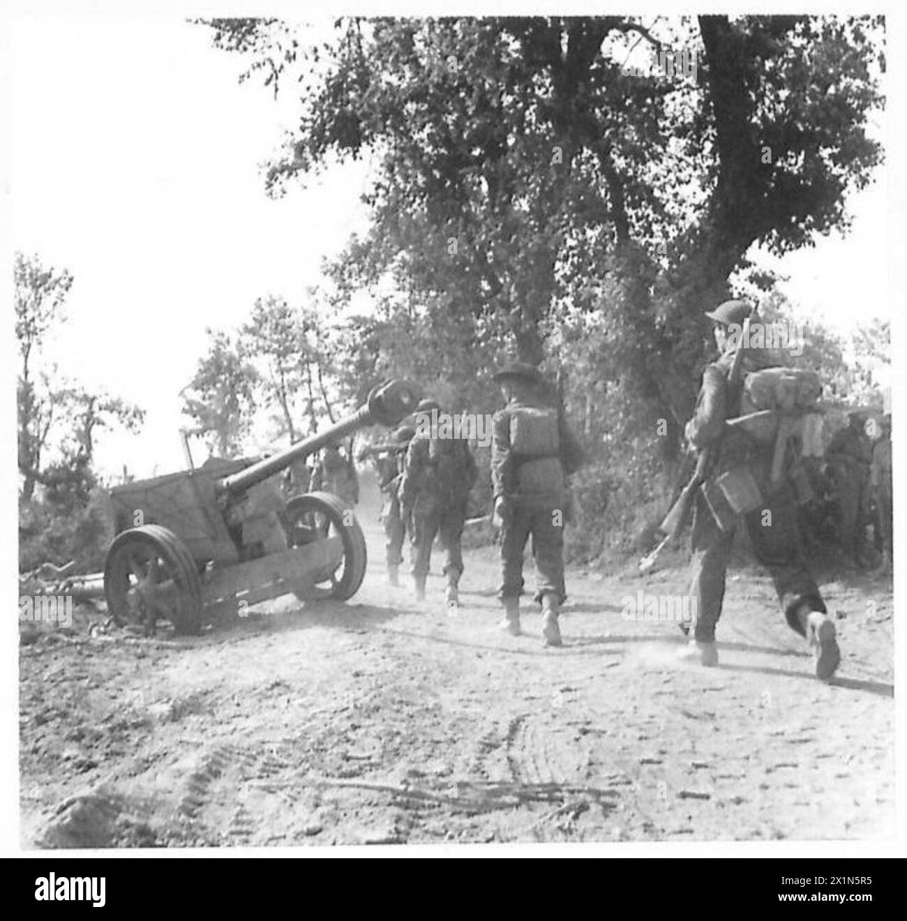 During the Eighth Army attack in Italy, Canadian troops pass disabled ...