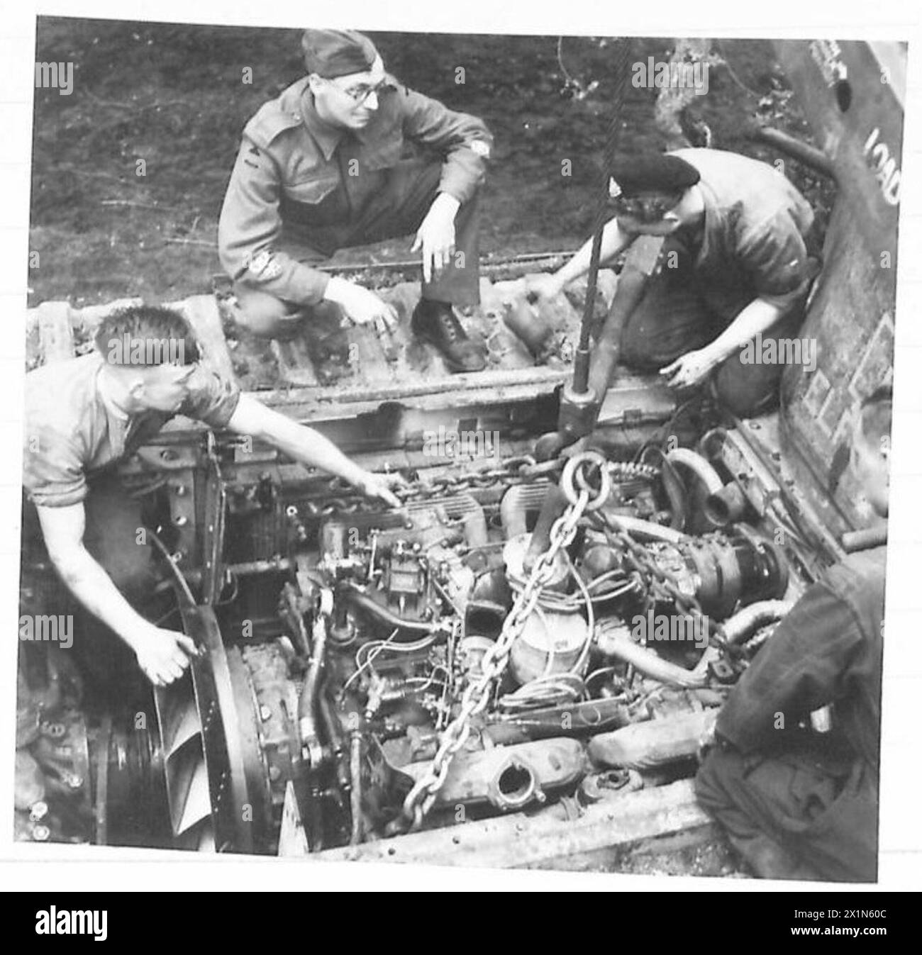 TANK RECOVERY AND REPAIR - With chains securely attached to the tank ...