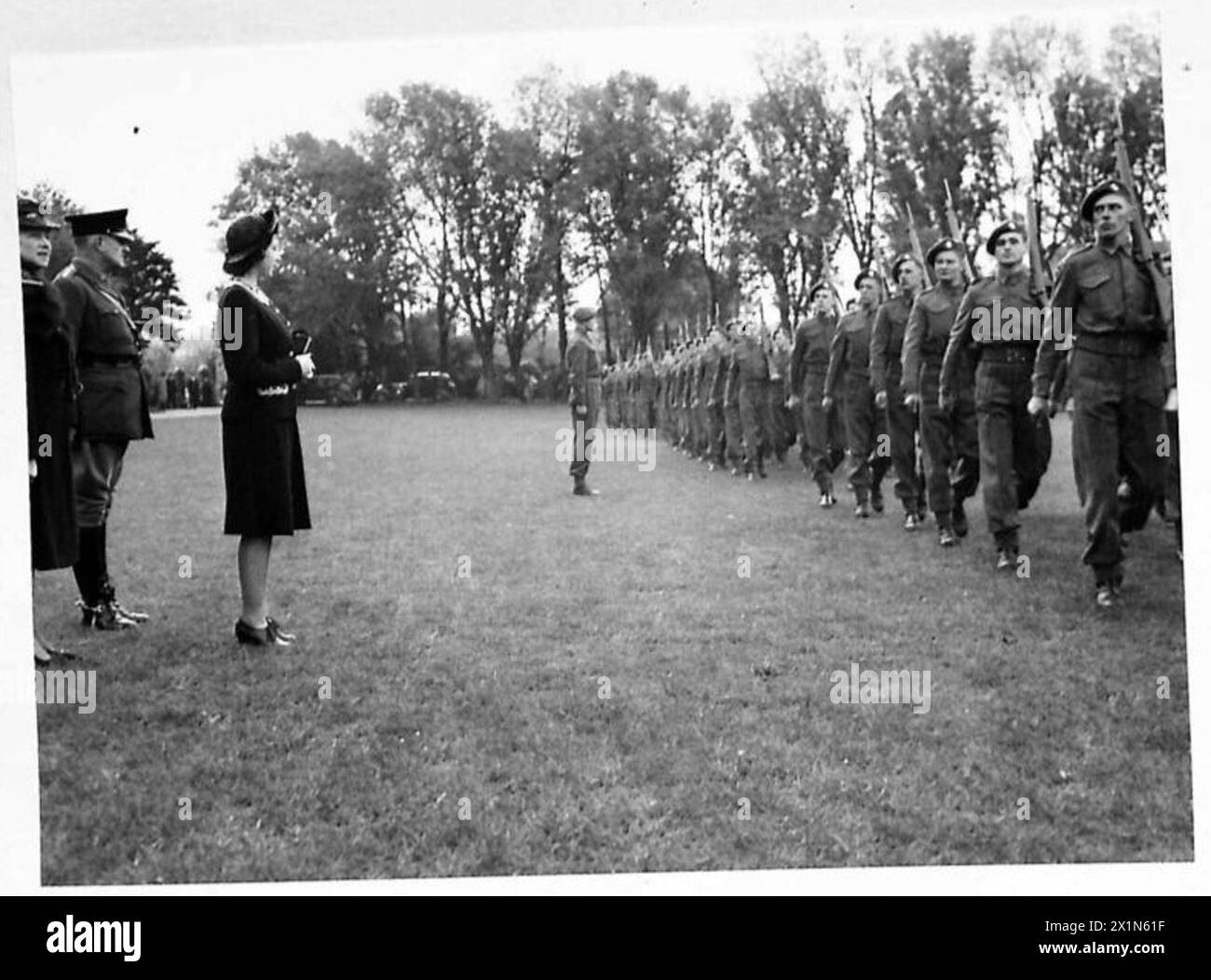 H.R.H. Princess Elizabeth inspects the Grenadier Guards during a march ...