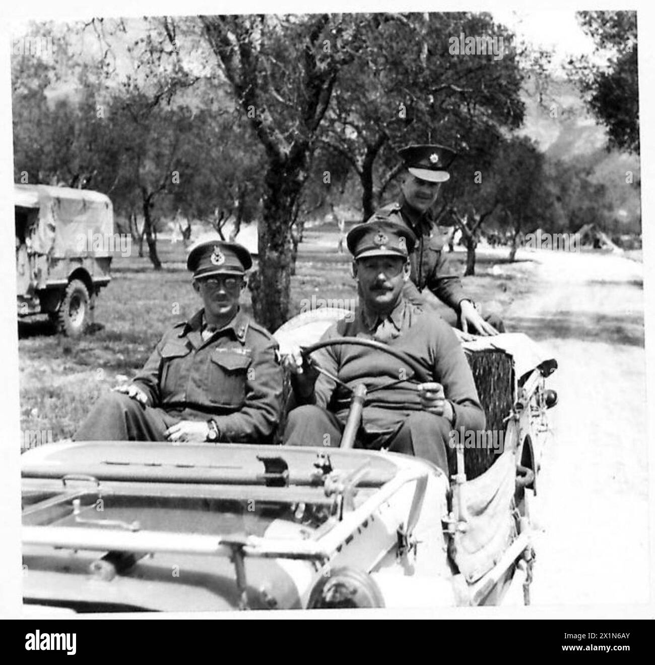 In Italy, a British Army General drives his own jeep and gives a lift ...