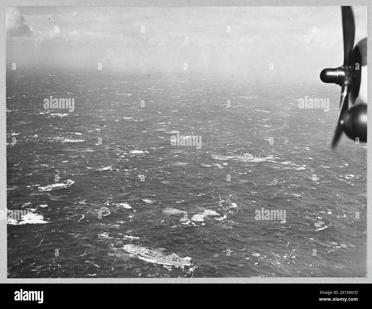 A Liberator aircraft observes a convoy at sea, detecting ships and ...