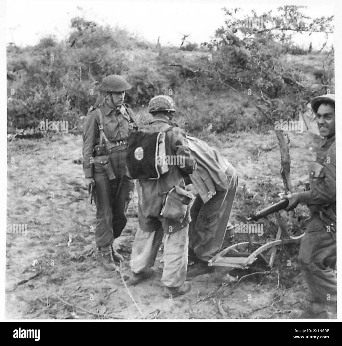 Major R.G. Hewitt of B Company, Green Howards, supervises German ...