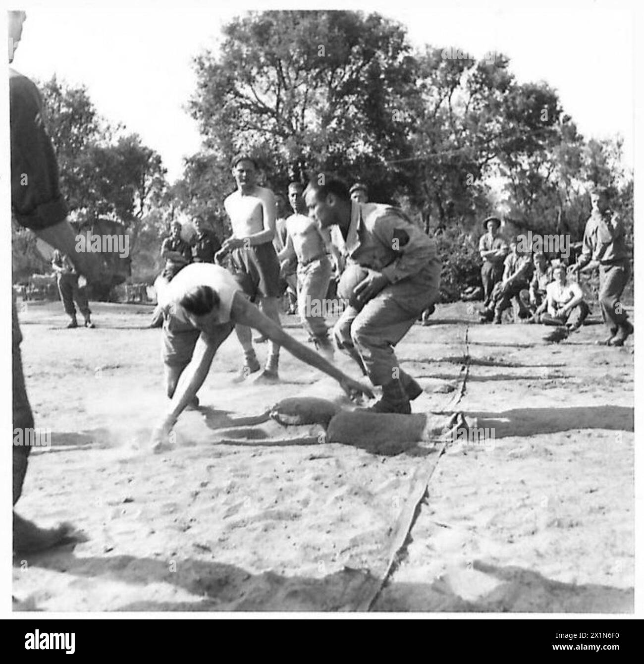 British and American soldiers playing basketball during incidents at the Fifth Army Anzio ...