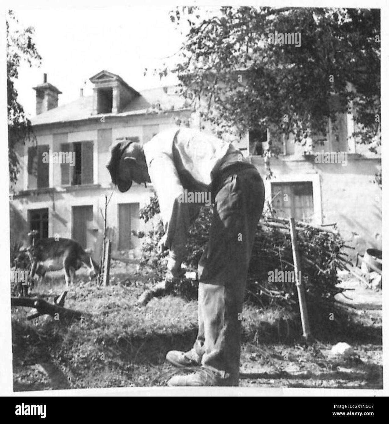 A FRENCH FAMILY RETURN TO THEIR SHELL TORN VILLAGE - The old ...