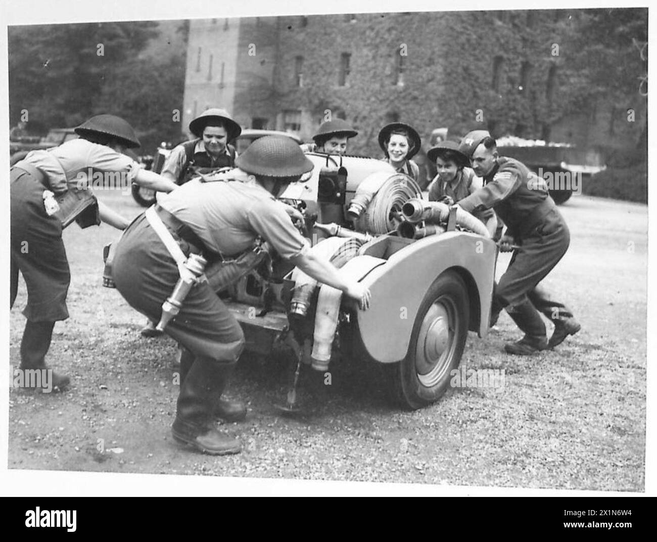 ATS fire squad members of the British Army receive firefighting ...