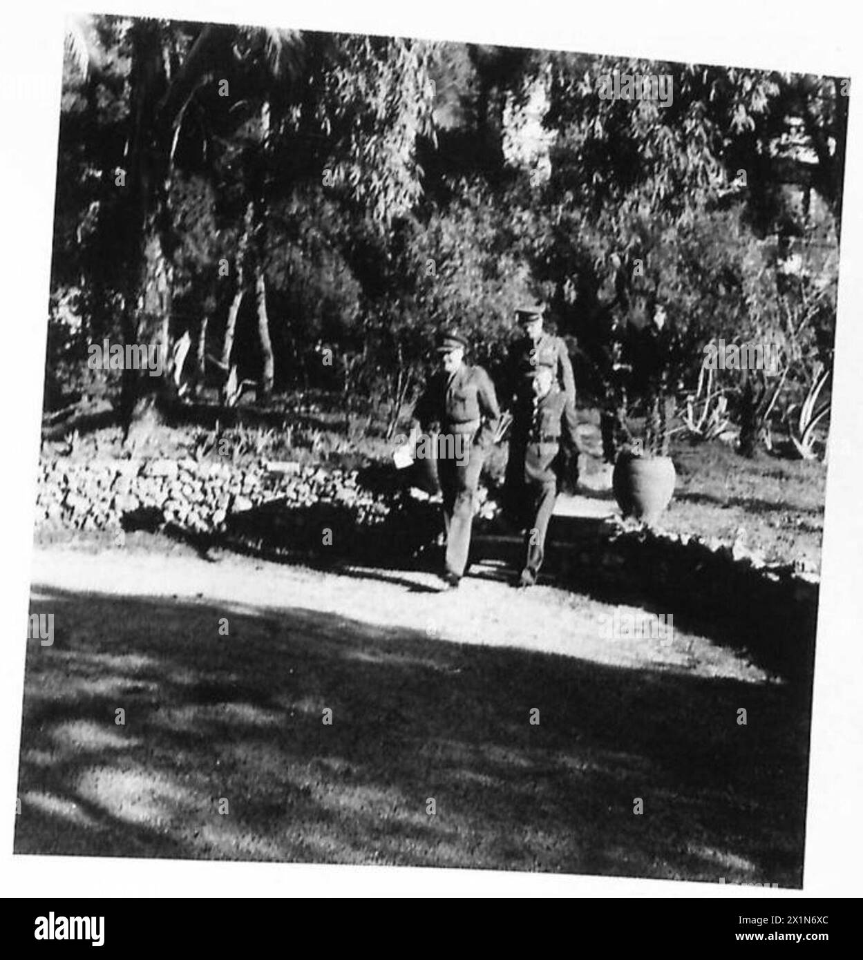The Adjutant General and party walk through the gardens of the School ...