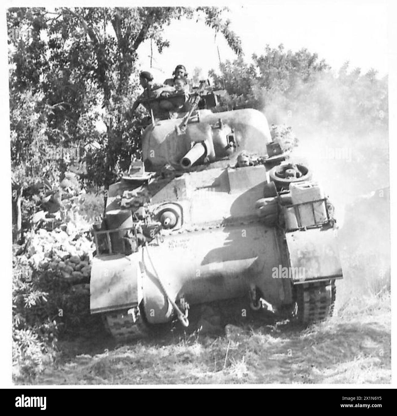 Units of the Royal Armoured Corps advance inland during the invasion of ...