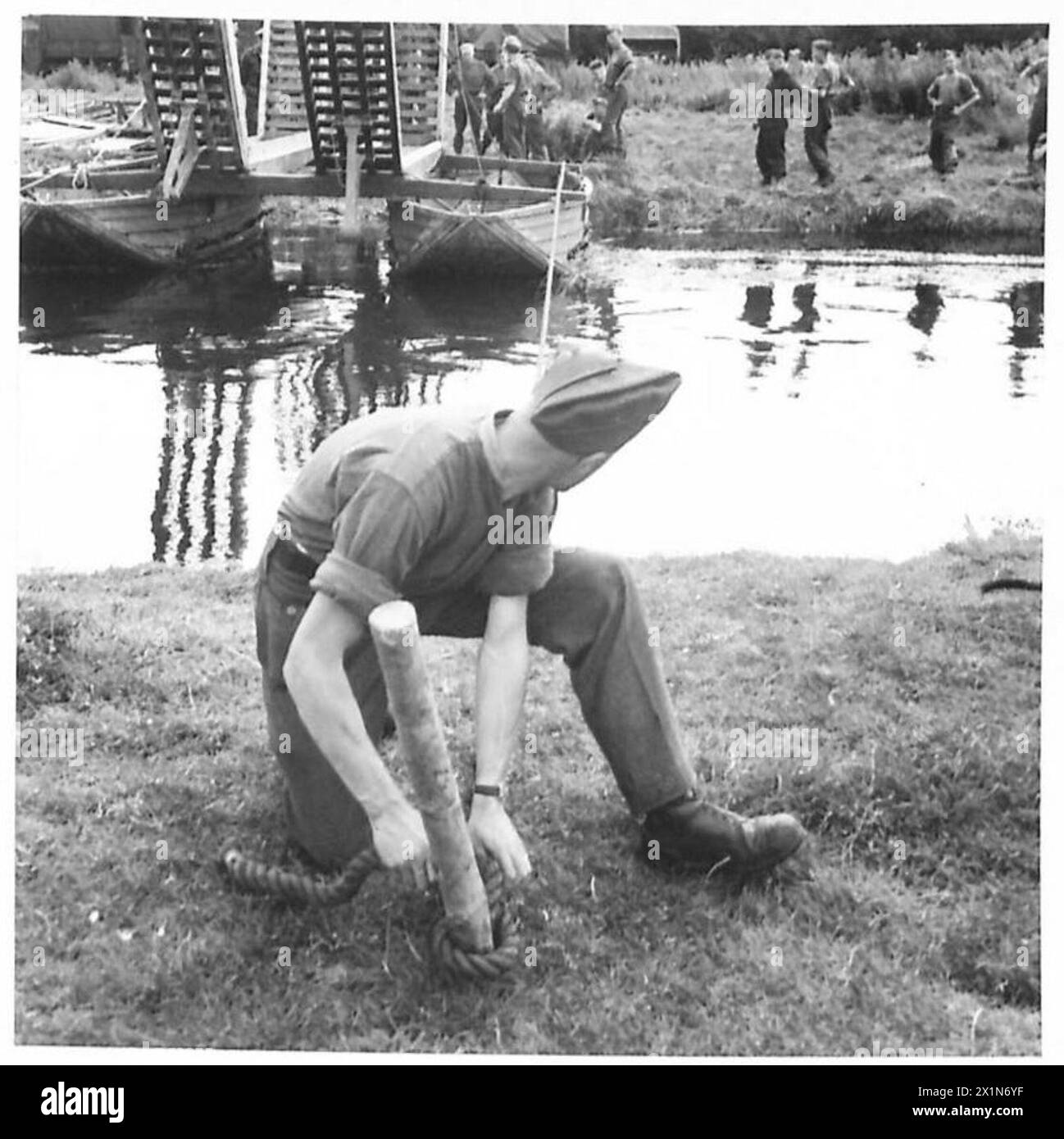 FERRYING EQUIPMENT ACROSS A RIVER - Adjusting the tightening one of the ...