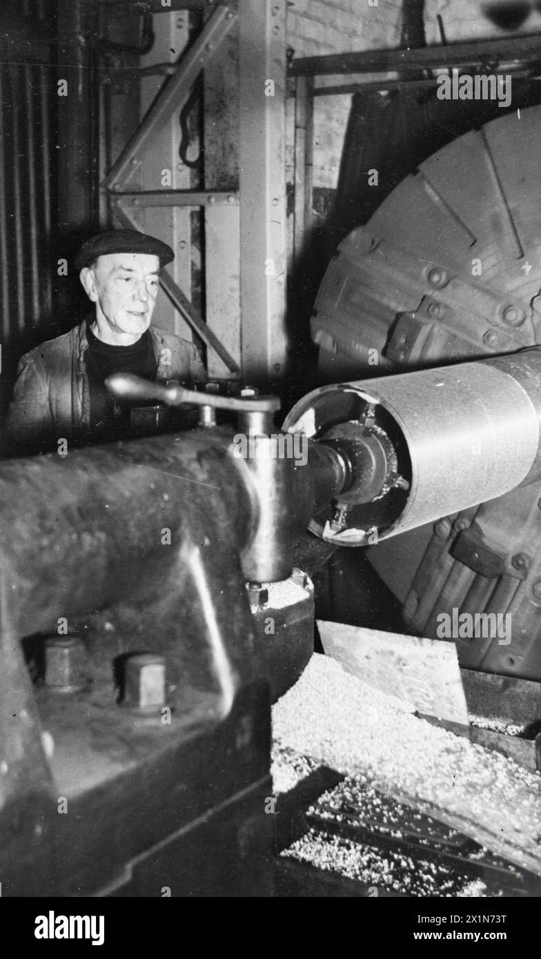 In March 1945, workers at Liverpool’s Charles Howson and Co. machine a ...