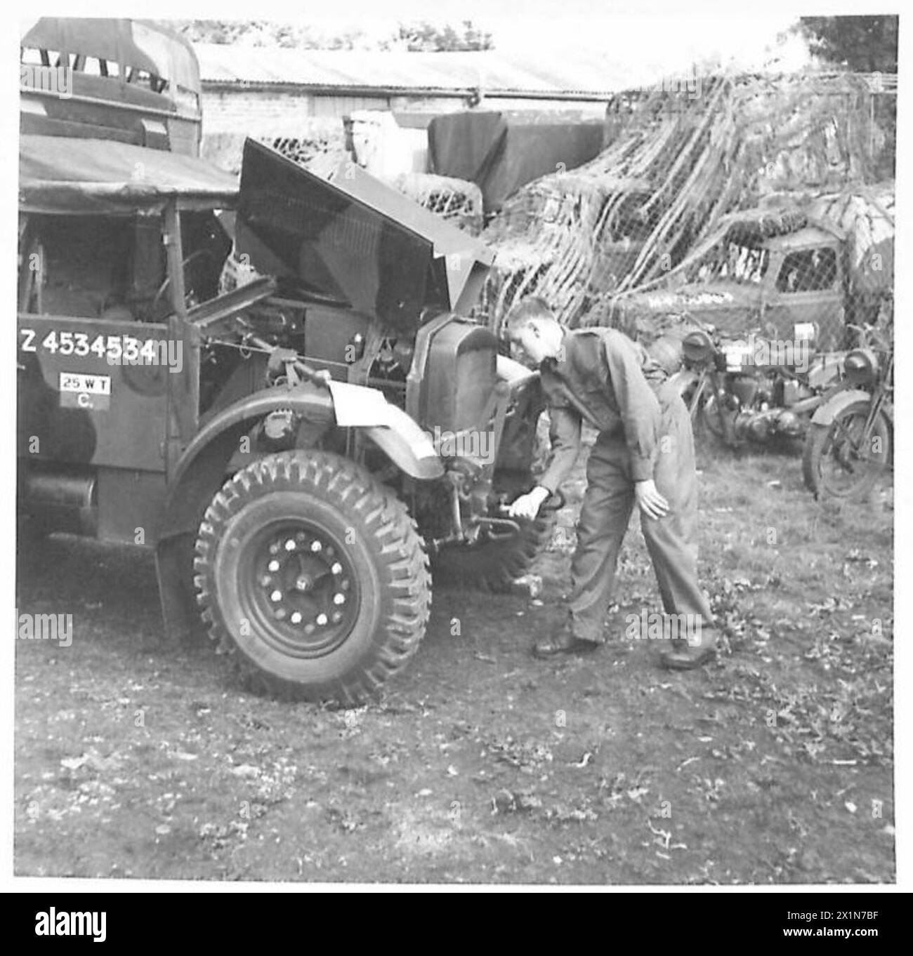 ROYAL CORPS OF SIGNALS - Soldier carrying out routine vehicle ...