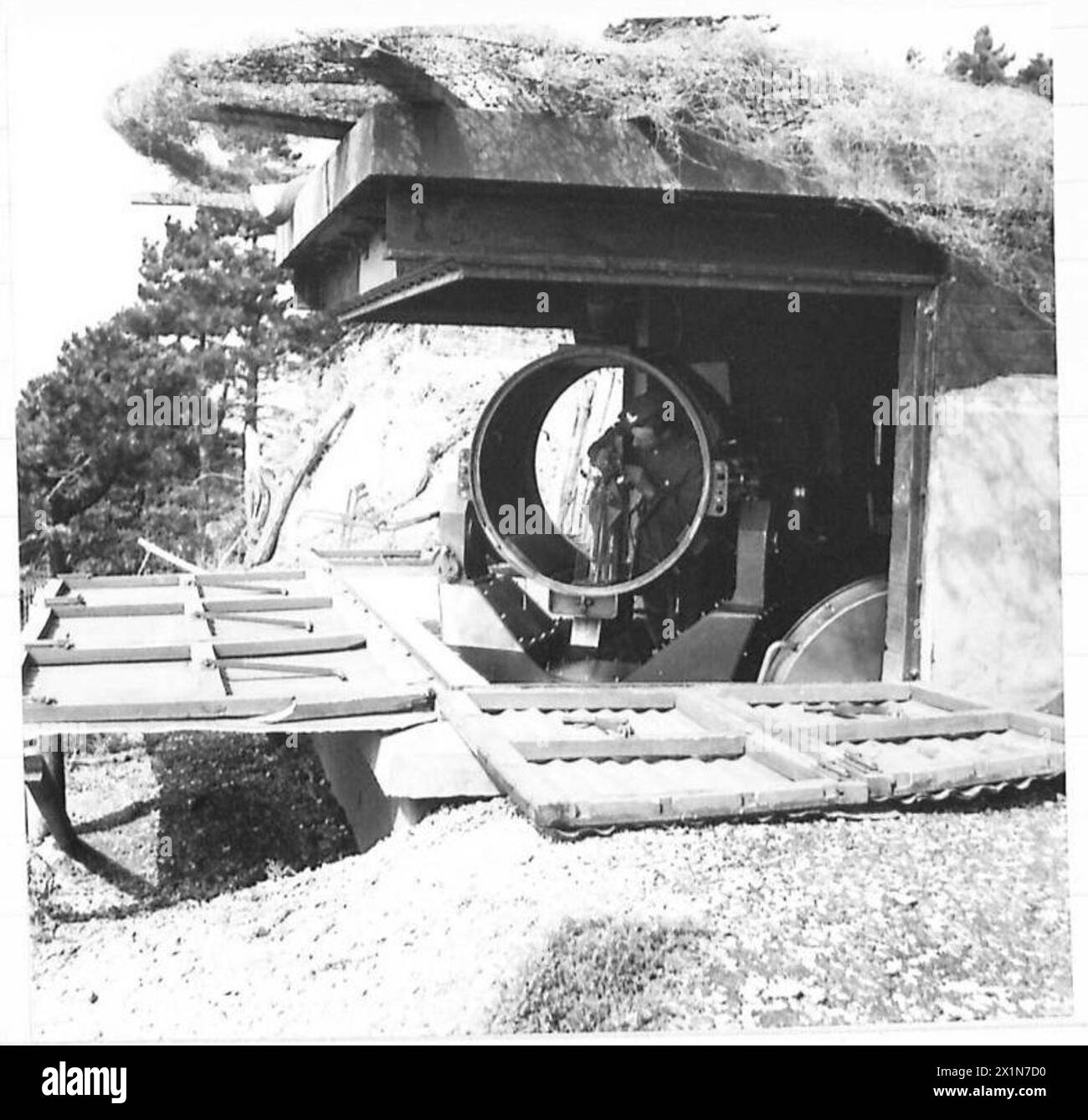 Maintenance work is performed on a coastal battery searchlight used for ...