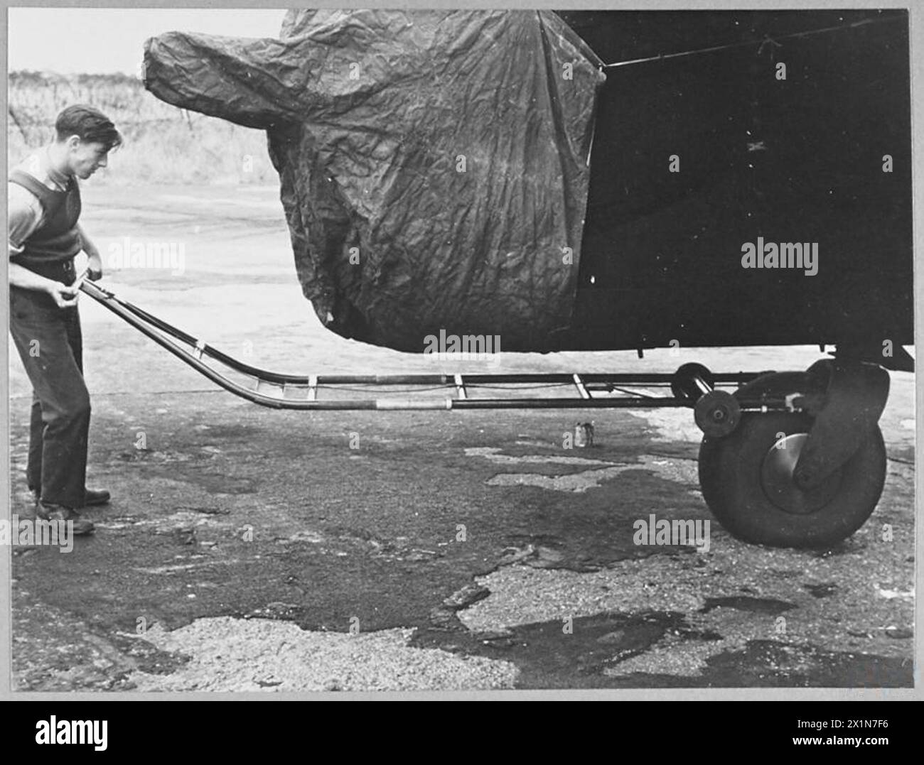 A tail wheel trolley is used as part of the RAF ground crew’s work to ...