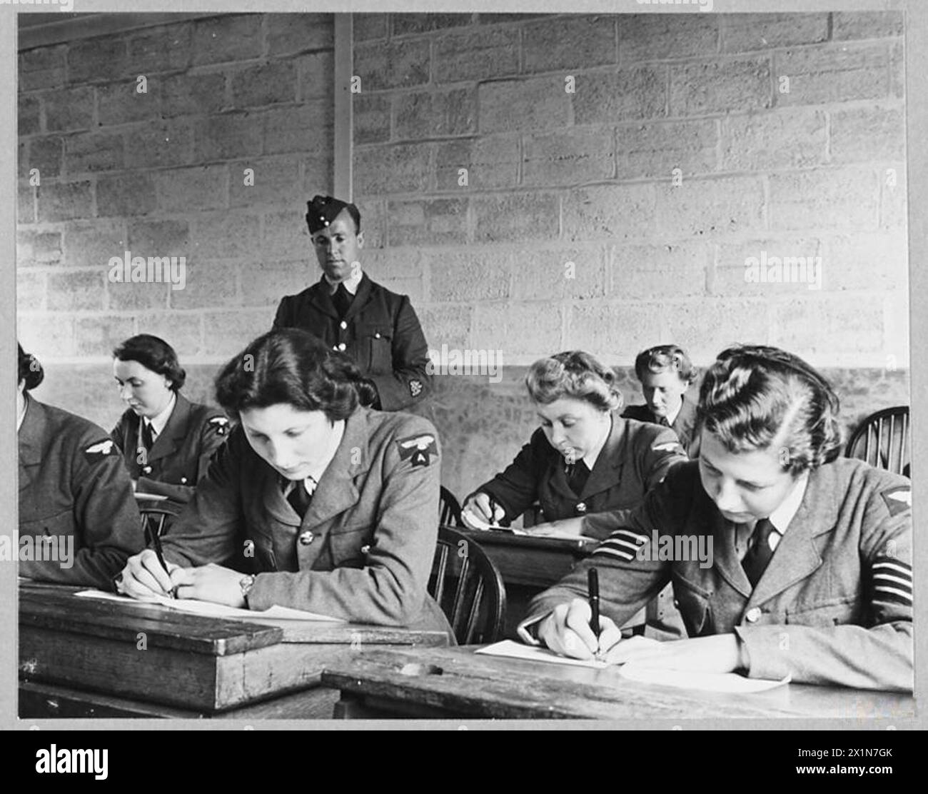 Ex-London policewoman Flight Officer Winifred Virtue trains W.A.A.F. Police recruits who patrol ...