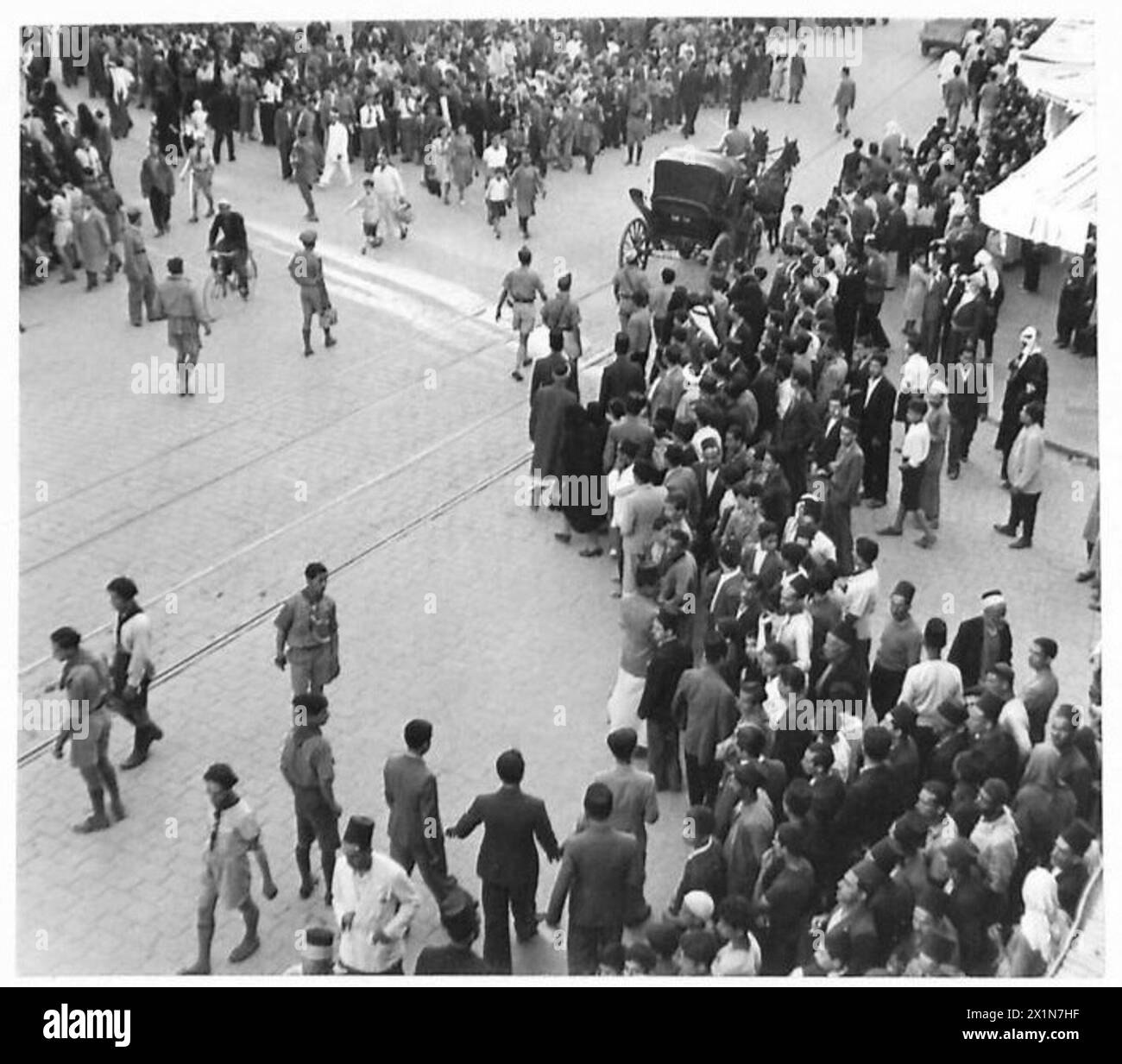 Inhabitants crowd the streets of Damascus to observe British and Free ...