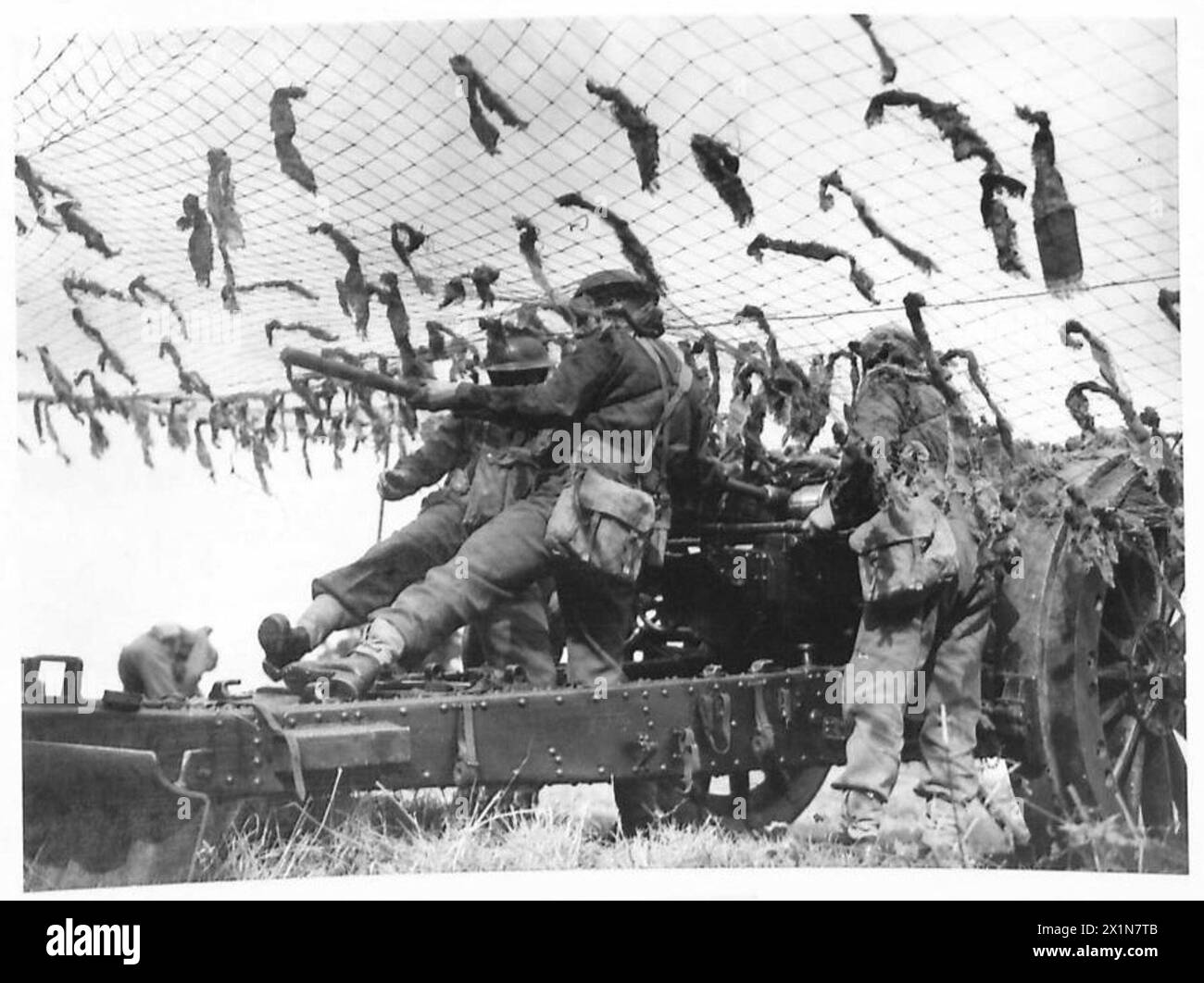 SPEEDING UP THE ARTILLERY - Ramming the shell into the breech ...